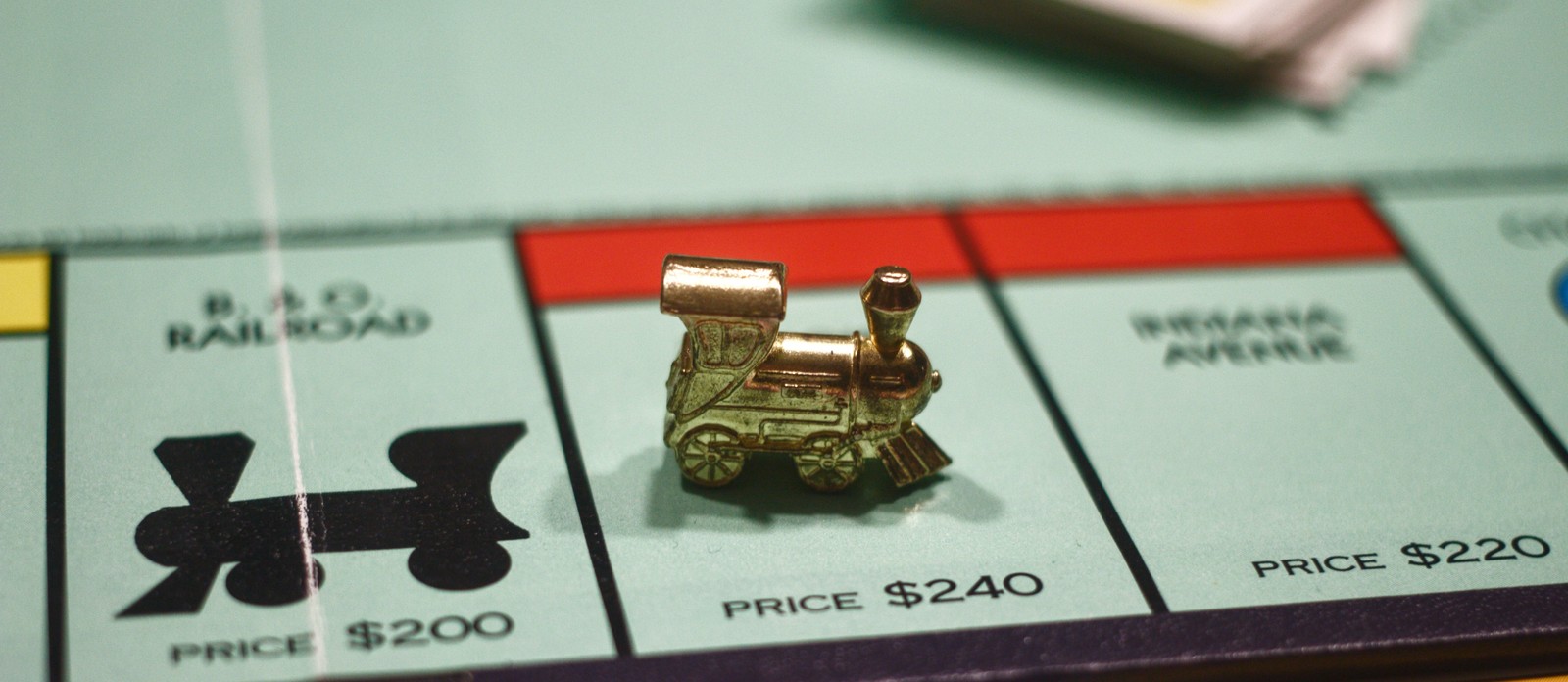 What color are the houses in the standard edition of Monopoly?