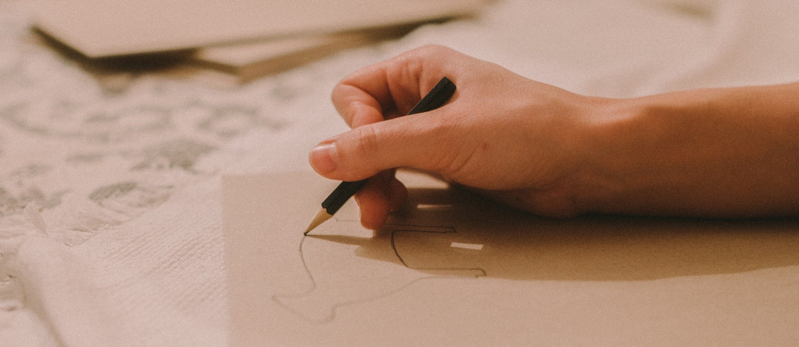 A geoglyph is a large design produced where?